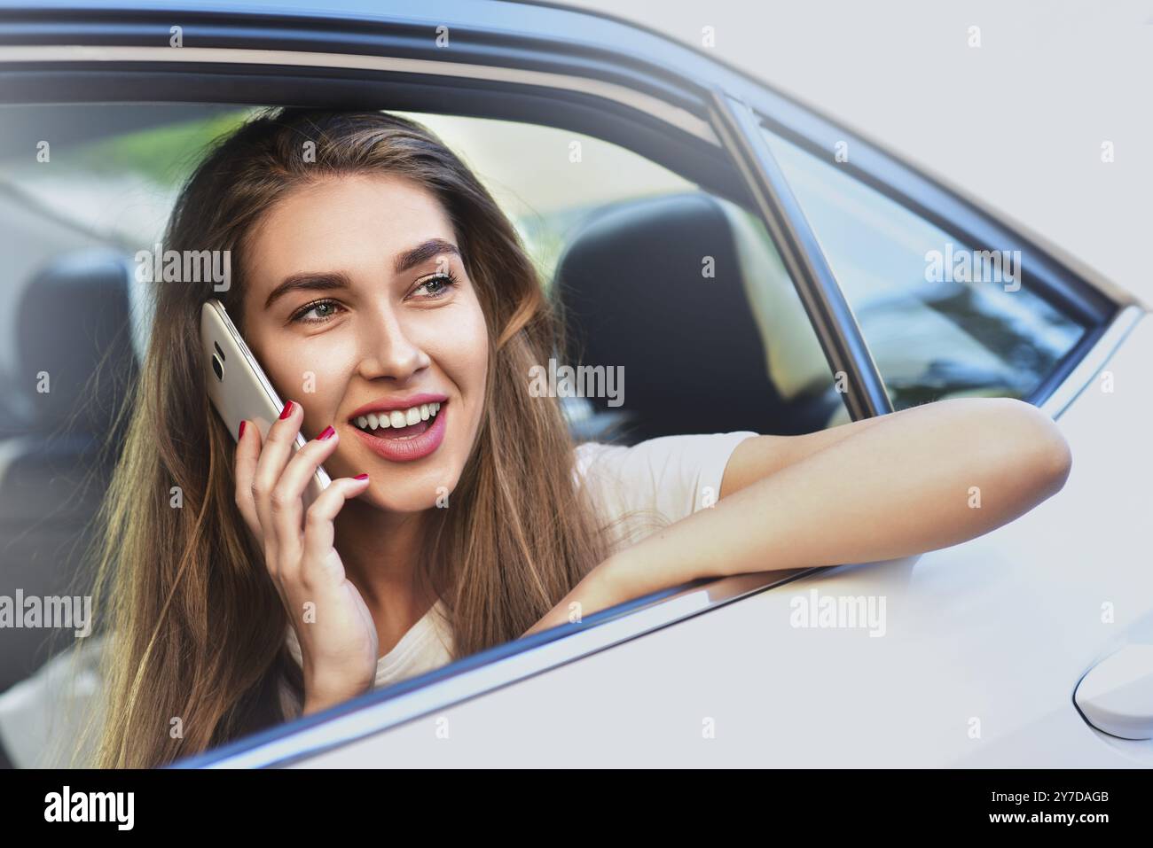 Portrait of a handsome girl driving her car Stock Photo - Alamy