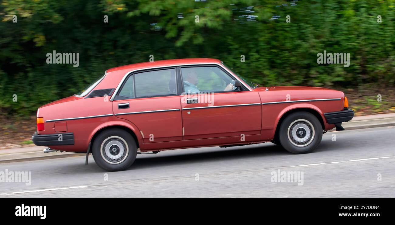 Milton Keynes,UK - Sept 29th 2024: 1984 red Morris Ital car driving on ...
