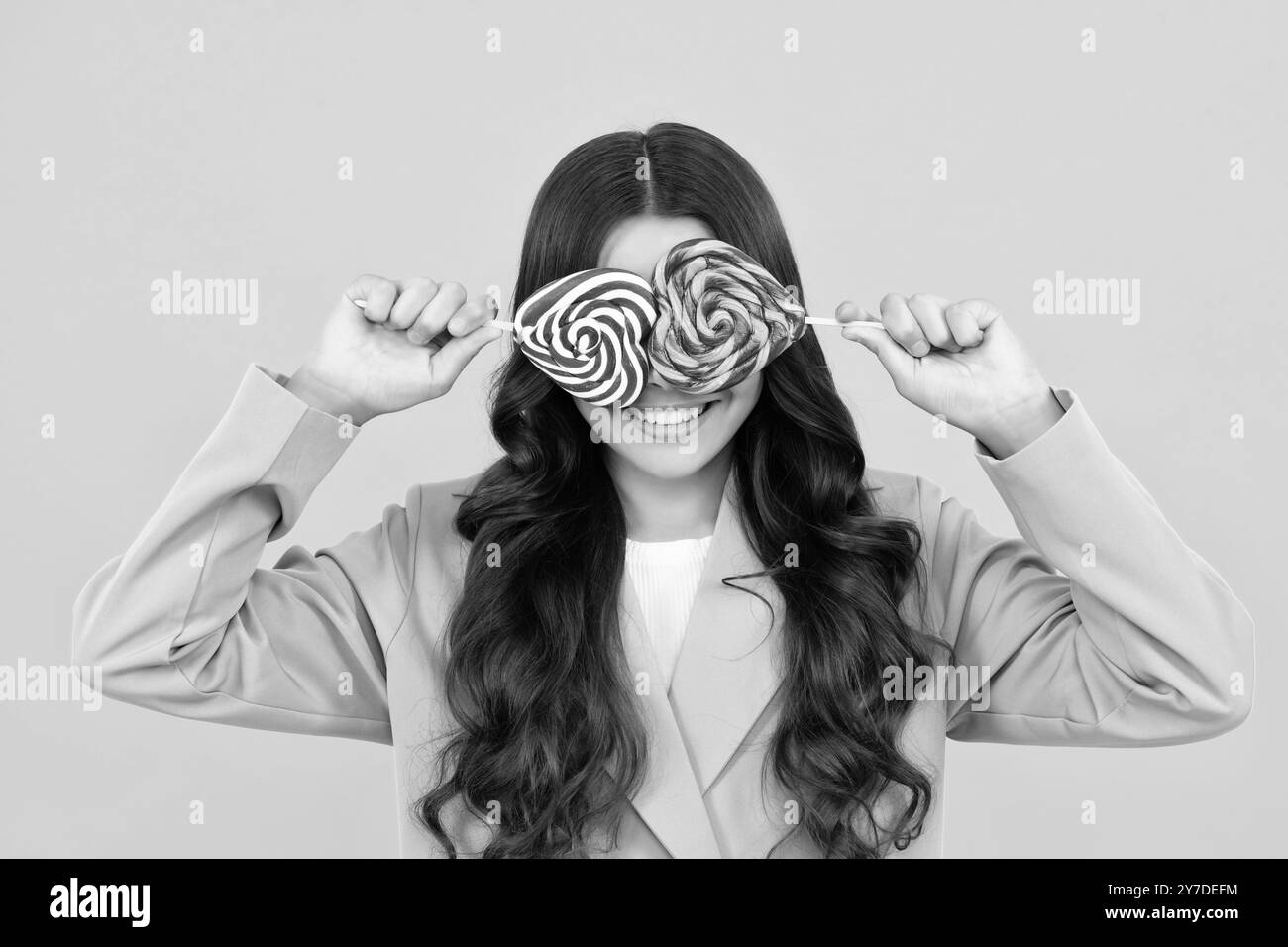 Teenager girl with caramel candies on sticks, sweet sugar addiction ...