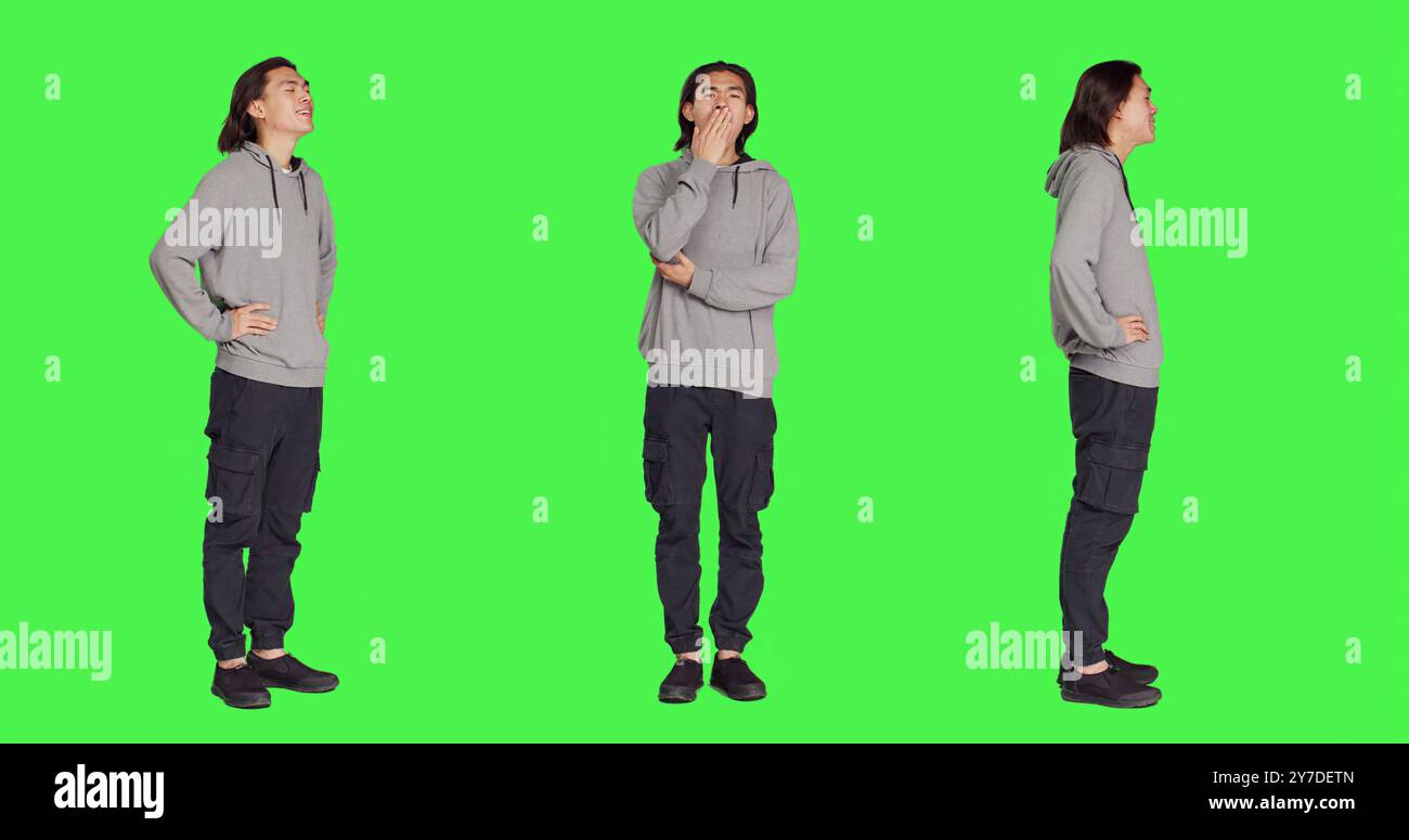 Young guy feeling sleepy and yawning after not getting enough sleep ...