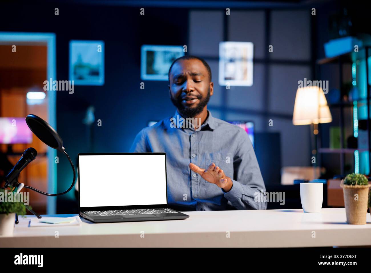 African american reviewer looking at mockup laptop, unsure how to rate ...