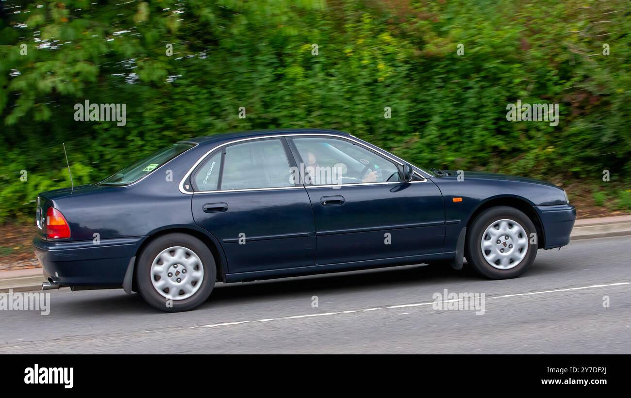 Milton Keynes,UK - Sept 29th 2024: 1998 blue Rover 618 car driving on a ...