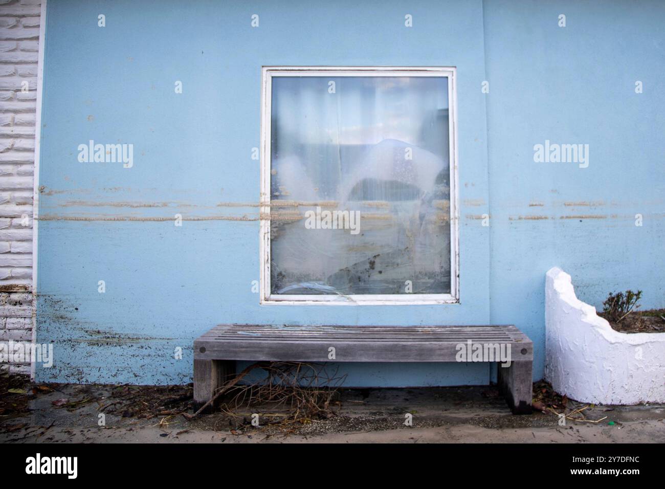 A water line from storm surge caused by Hurricane Helene is seen on ...
