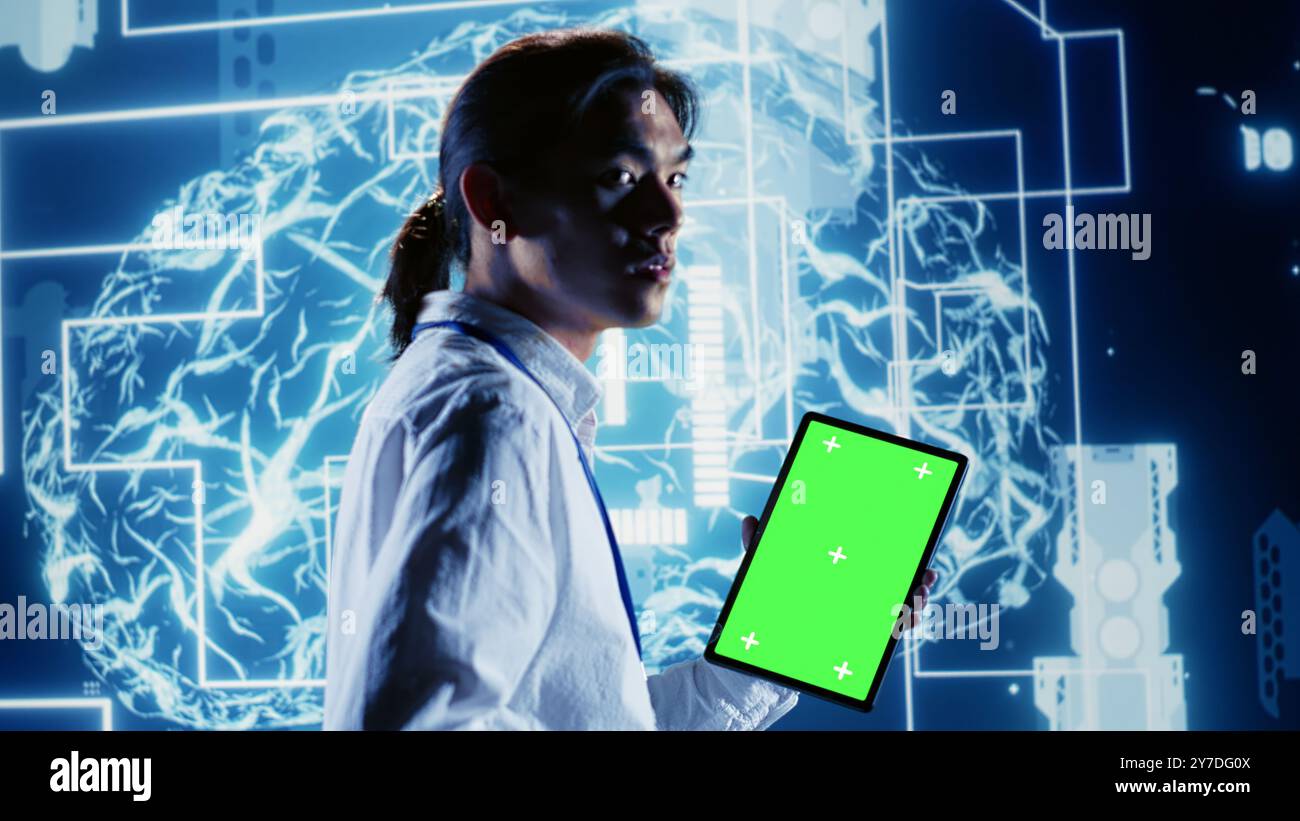 Tech savvy IT practitioner using green screen tablet to implement ... Tech savvy IT practitioner using green screen tablet to implement ...