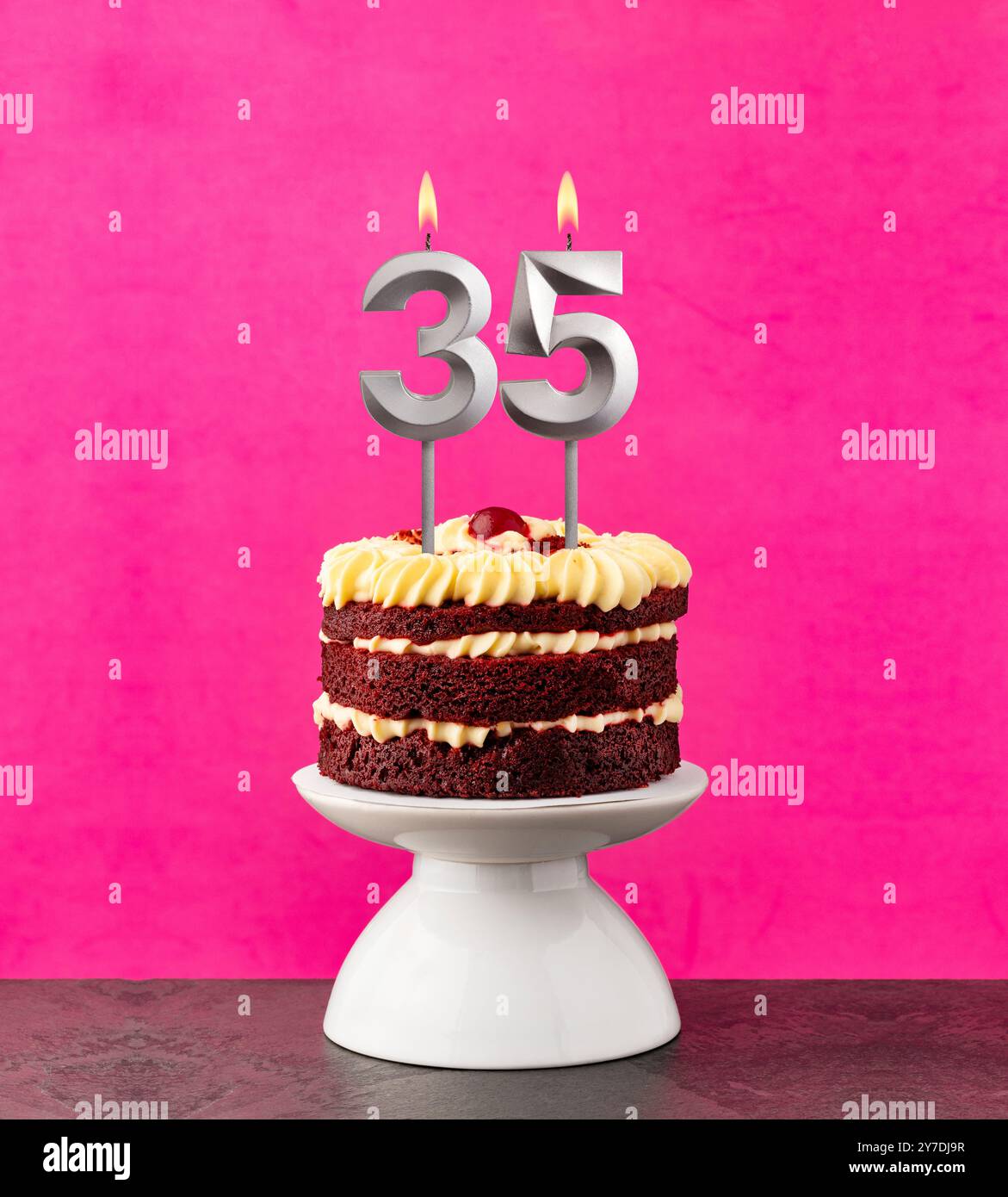 Birthday cake with number 35 candle - Red velvet on a fuchsia ...