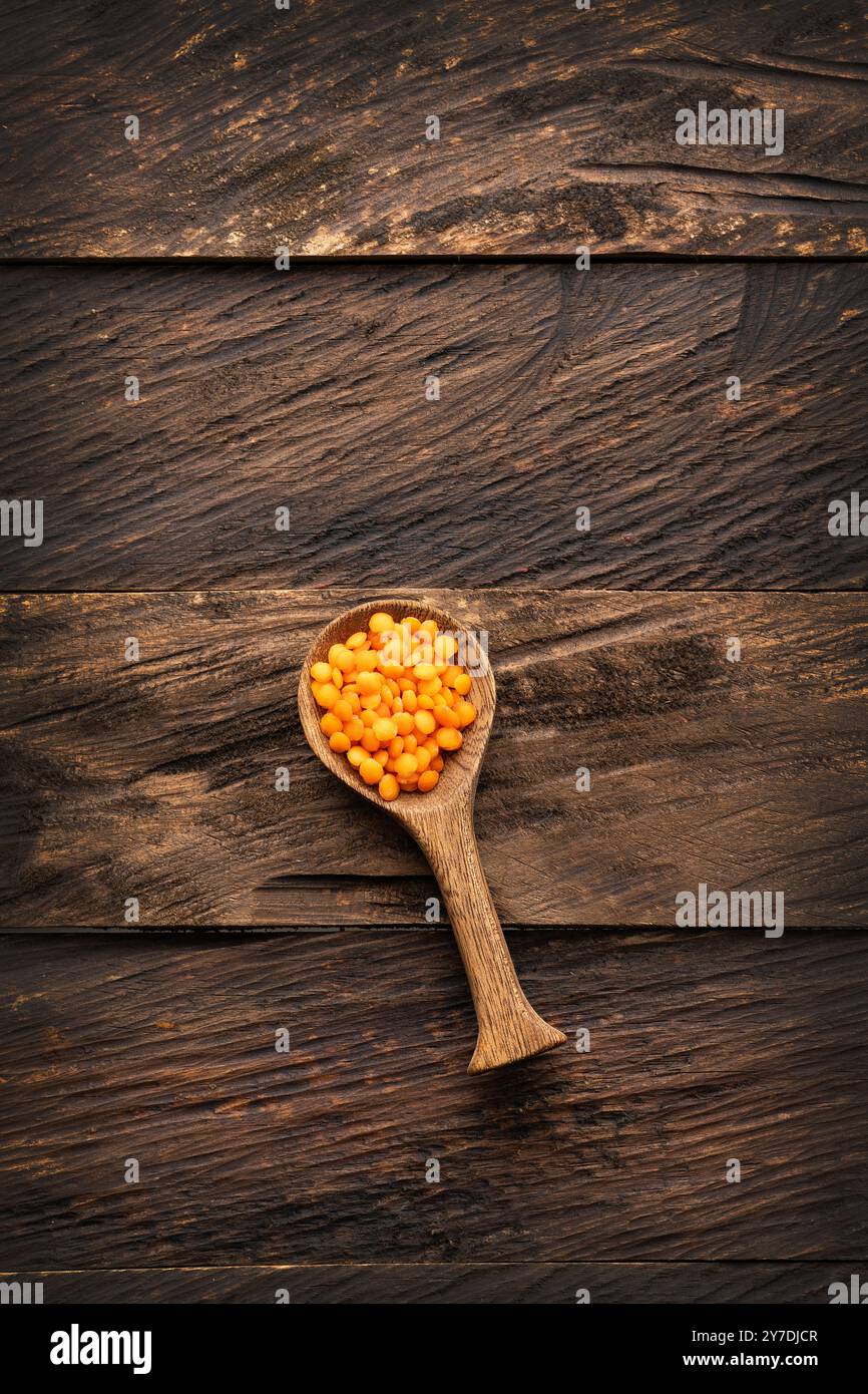 Lens culinaris - Organic red lentils on the spoon Stock Photo - Alamy