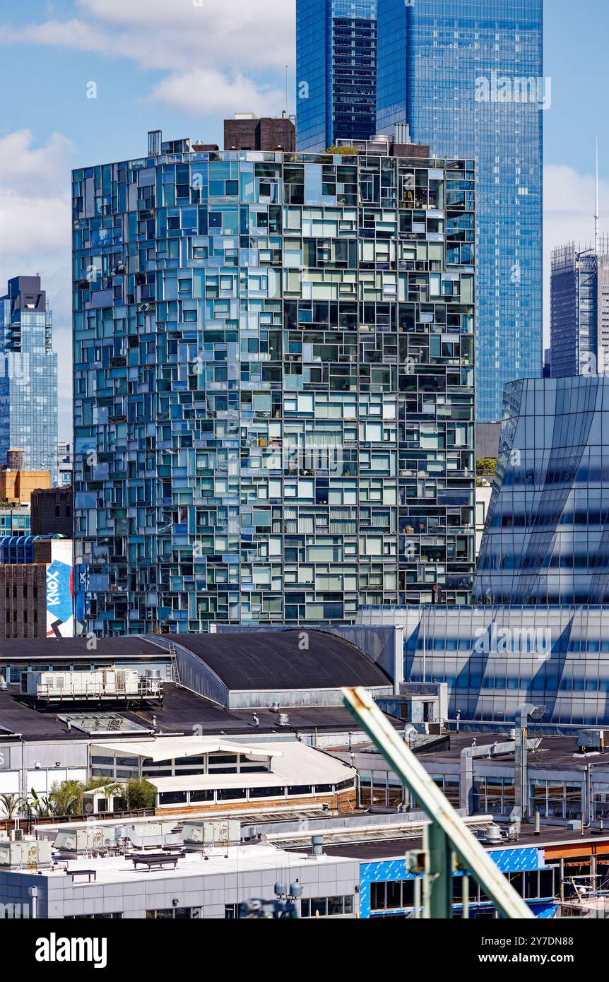 The unique abstract glass mosaic façade of Jean Nouvel-designed 100 ...