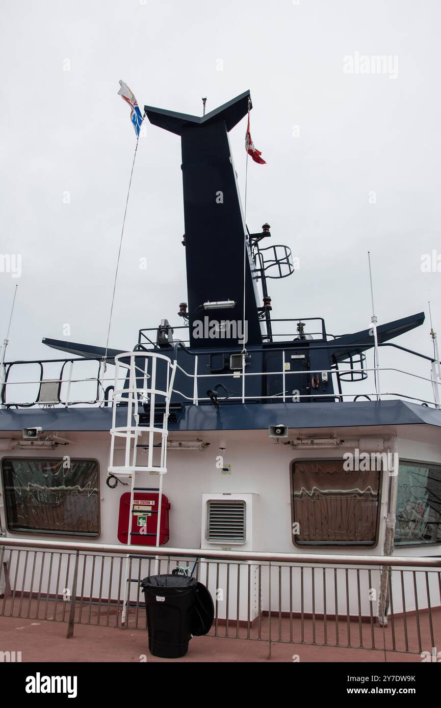 Flags flying on the Legionnaire ferry to Bell Island, Newfoundland ...