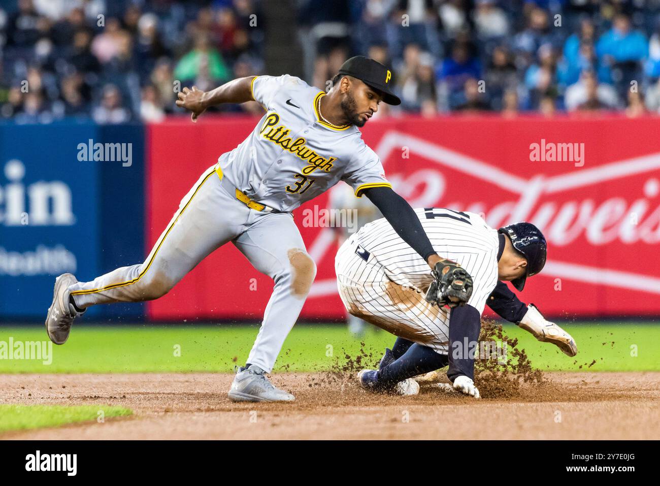 New York Yankees' Anthony Volpe, right, arrives safely at second base ...