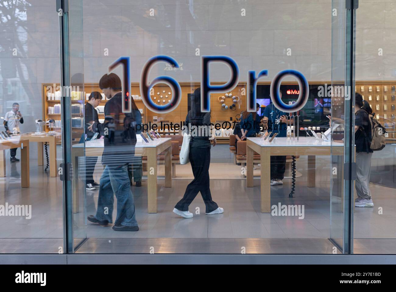 The front window of the Apple store in Omotesando with the inscription ...