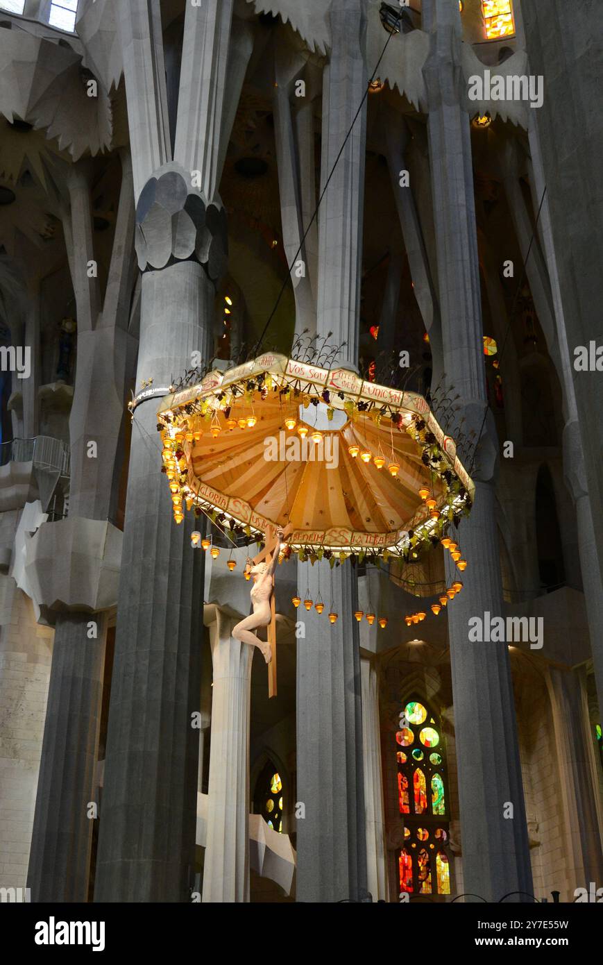 Crucified Jesus Christ statue above altar in the Sagrada Familia basilica in Barcelona ...