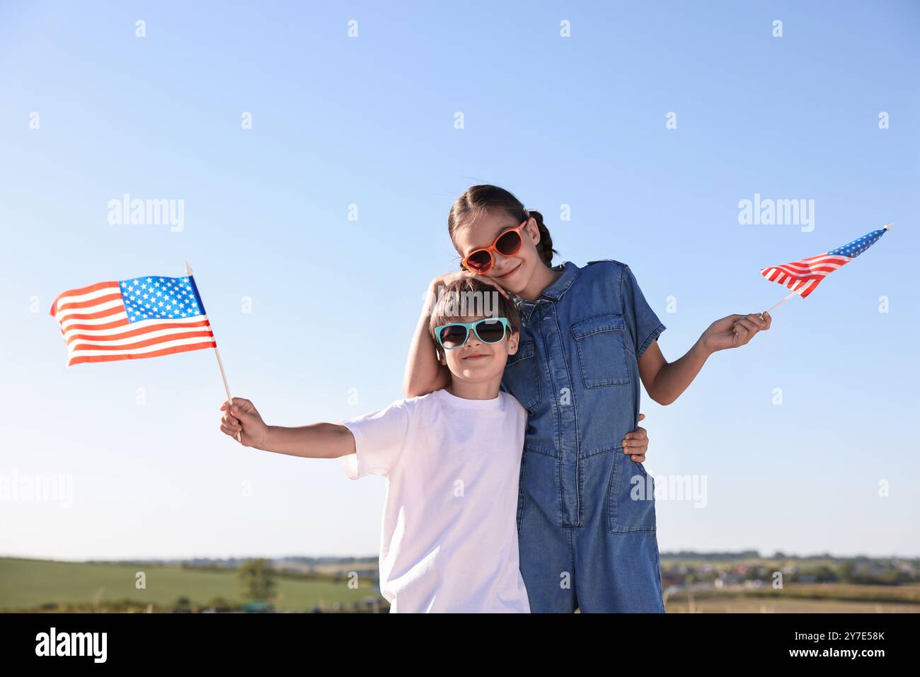 Brother and sister with flags of USA outdoors Stock Photo - Alamy