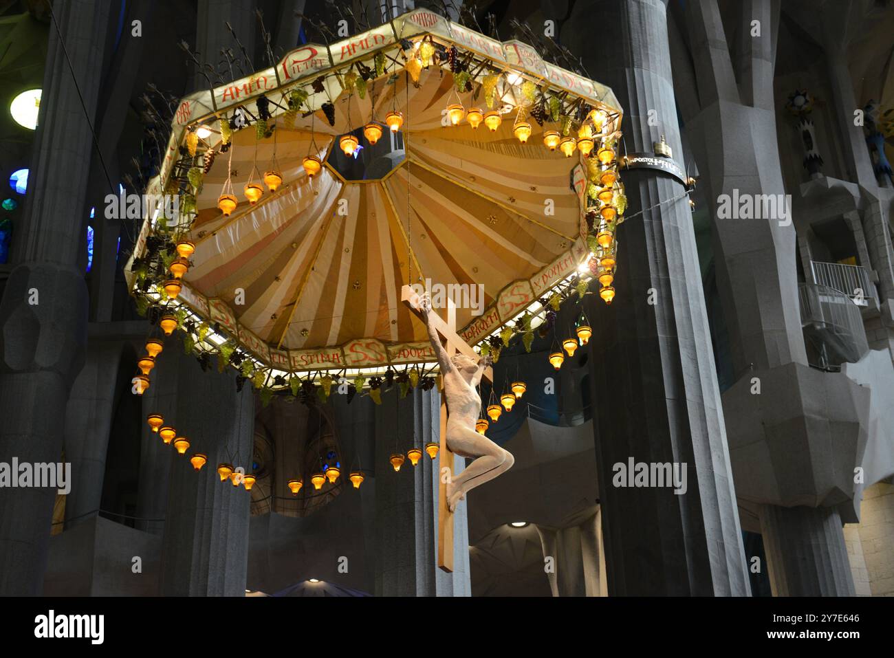 Crucified Jesus Christ statue above altar in the Sagrada Familia basilica in Barcelona ...