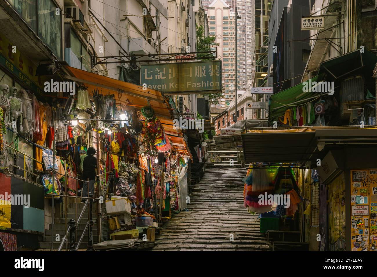 Old Hong Kong street in Central, with steep steps and shops selling ...