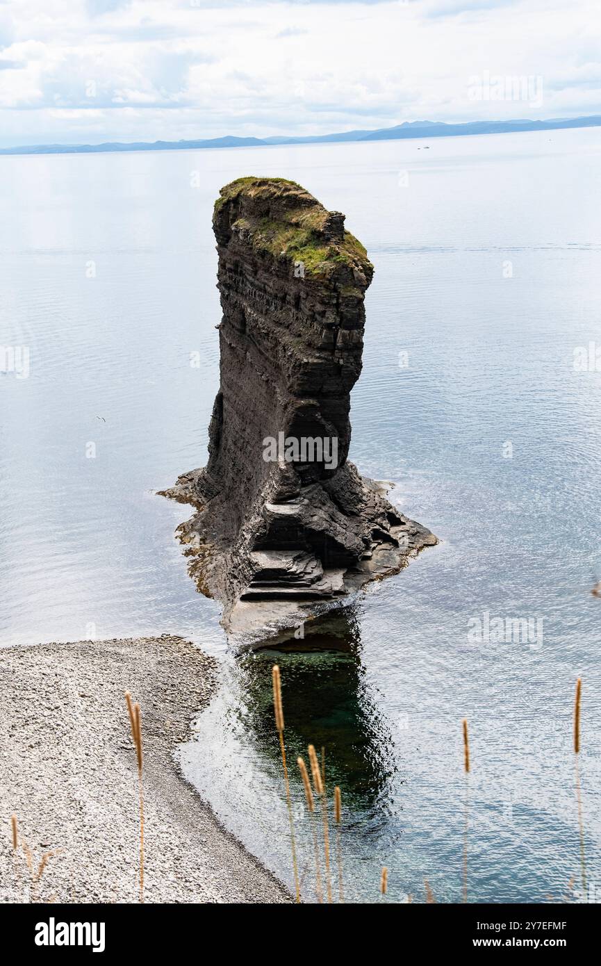 Skinny sea stack on the beach near the Bell on Bell Island ...