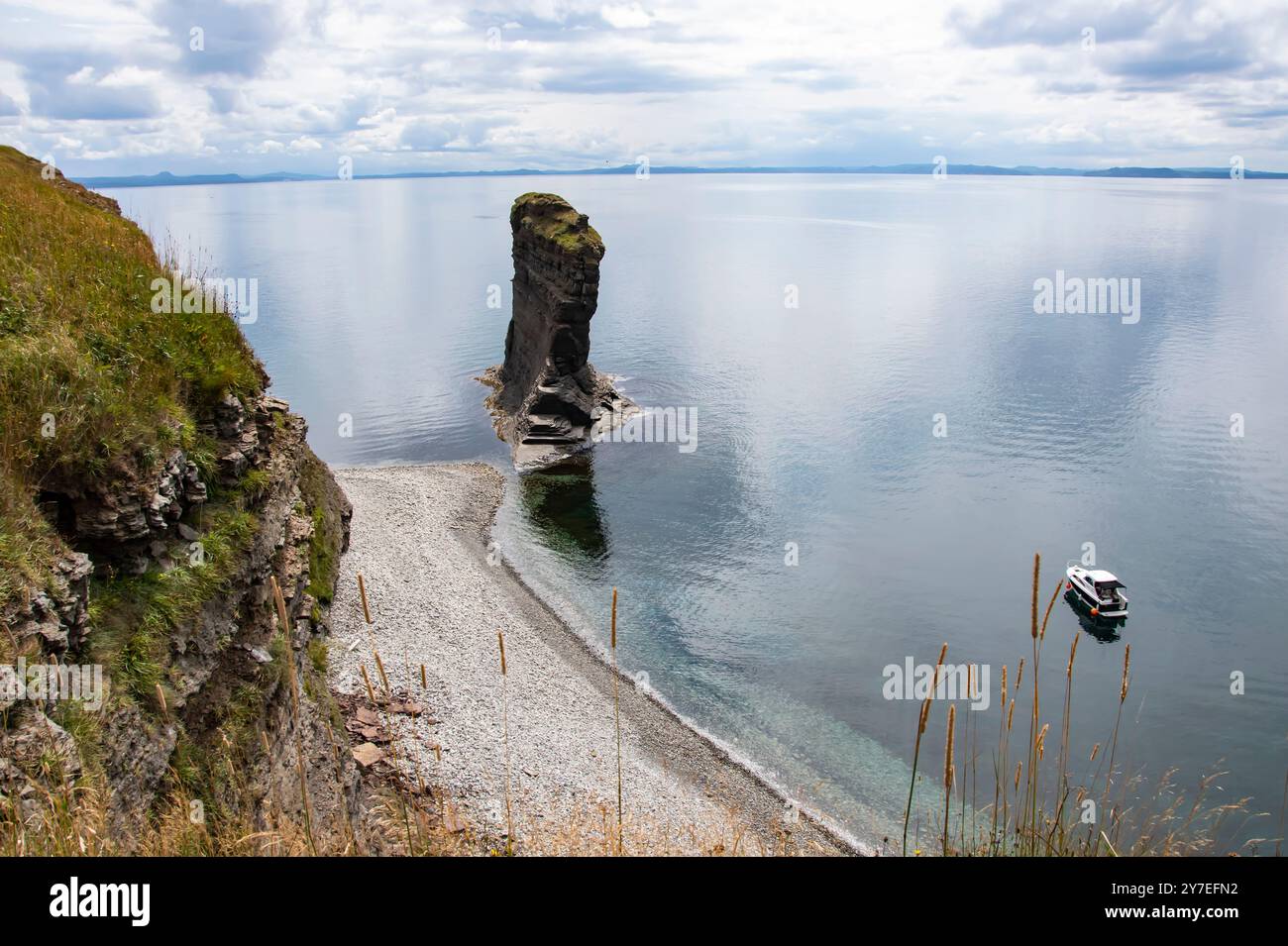 Skinny sea stack on the beach near the Bell on Bell Island ...