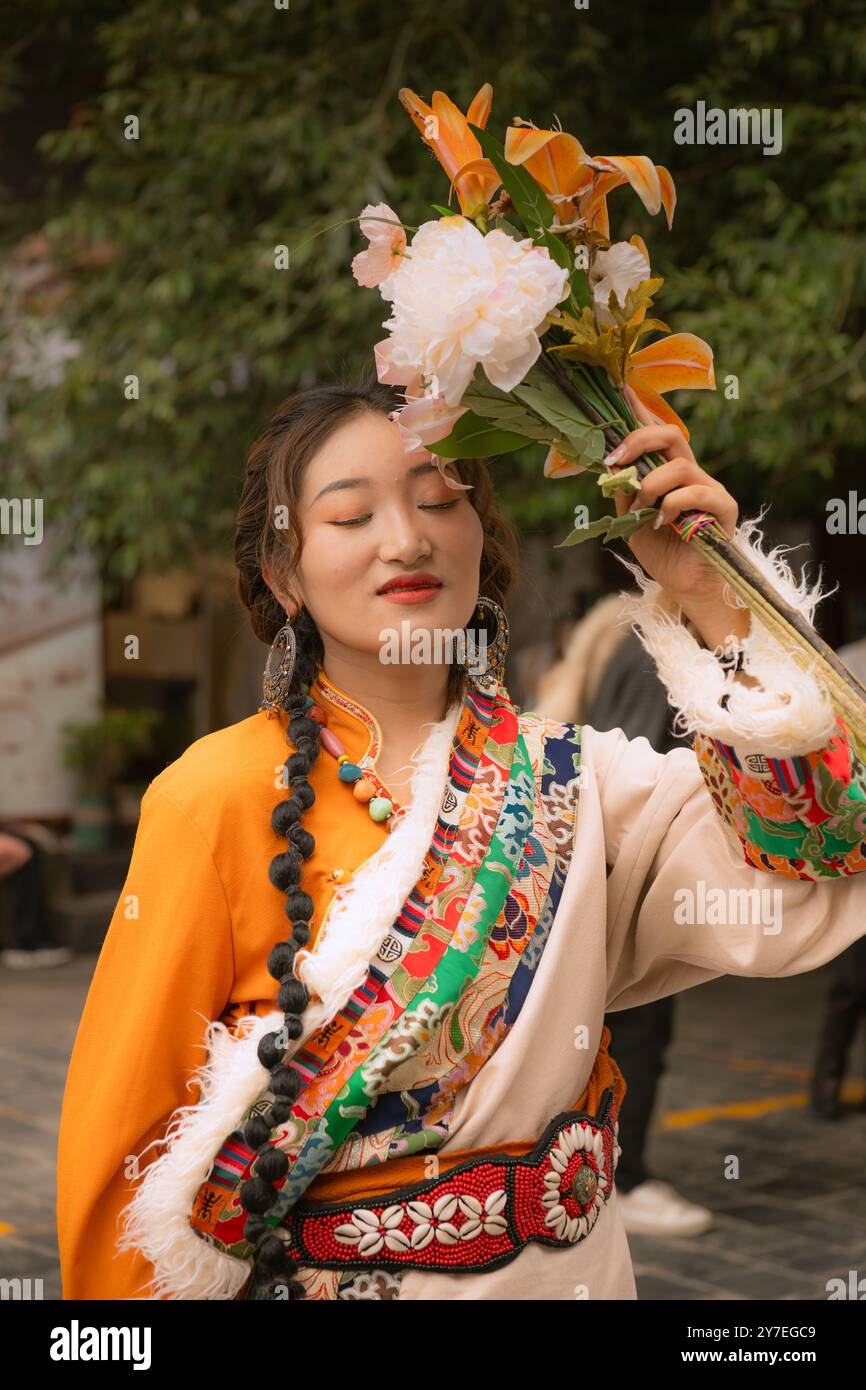 LHASA, TIBET CHINA - JULY 3, 2022: A girl wearing traditional Tibetan ...