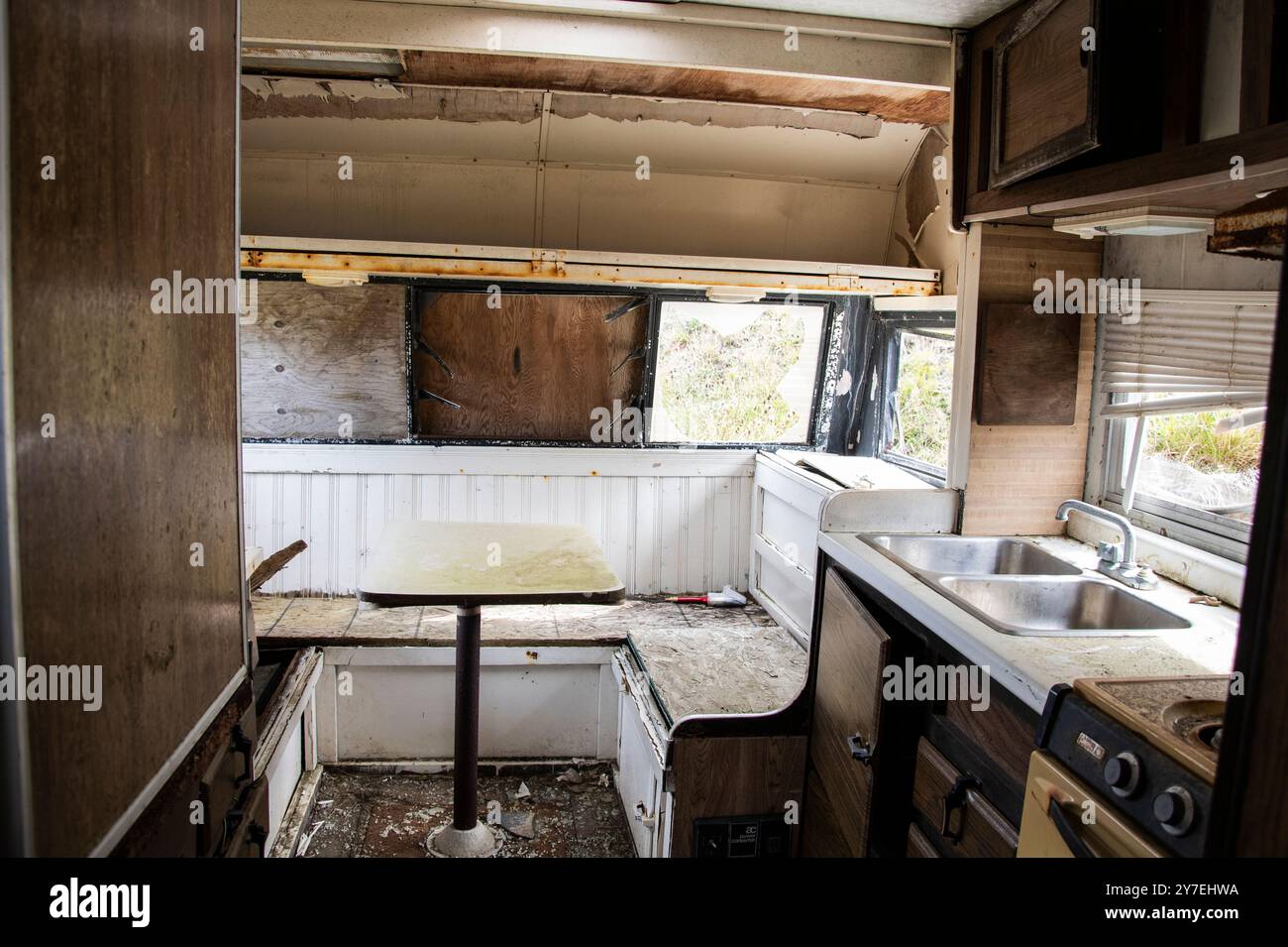 Kitchen inside abandoned dilapidated RV at the Bell on Bell Island ...