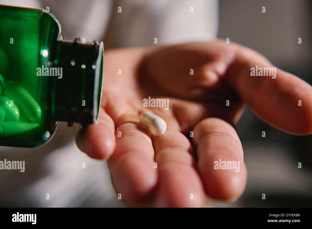 Male hand pouring green medicine hi-res stock photography and images ...