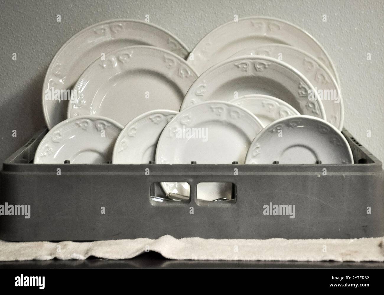 Photography of white dishes, plates, and saucers air drying on a ...
