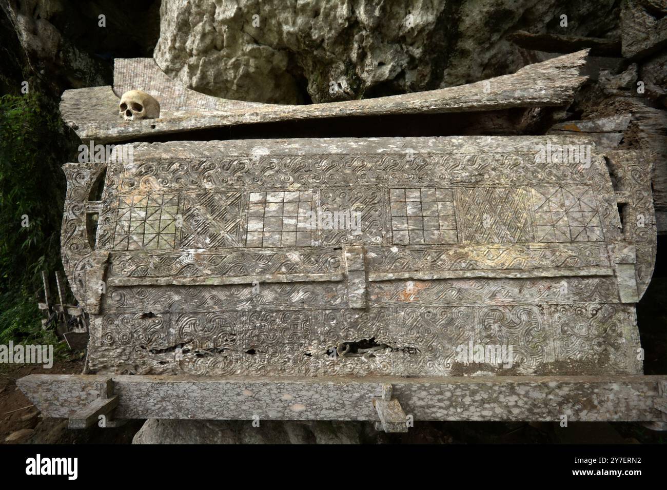 Decorative carving on wooden sarcophagus at the traditional burial site ...