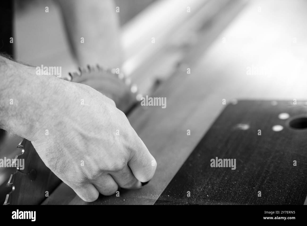 Person cutting wood on table Black and White Stock Photos & Images - Alamy