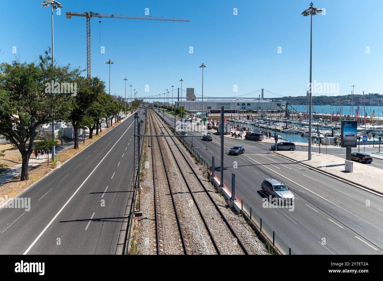 Lisbon, Portugal - September 8, 2024 : Cars traverse a wide road beside ...