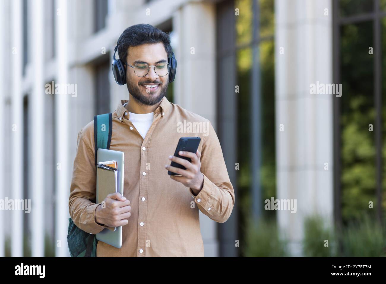 Guy wearing headphones holding tablet hi-res stock photography and ...