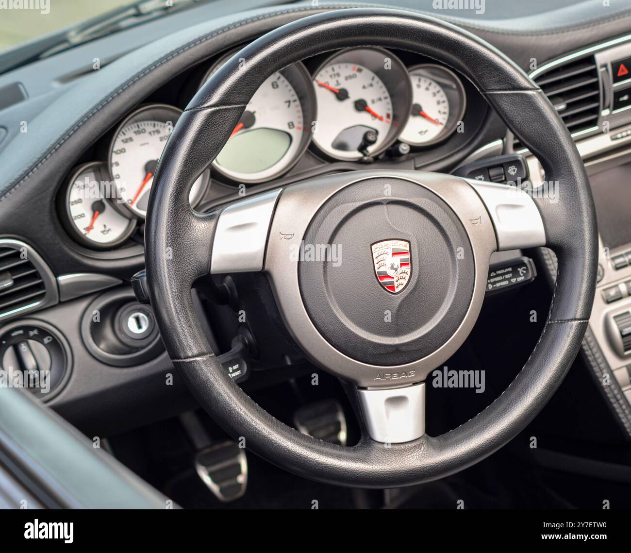 Porsche steering wheel Stock Photo - Alamy