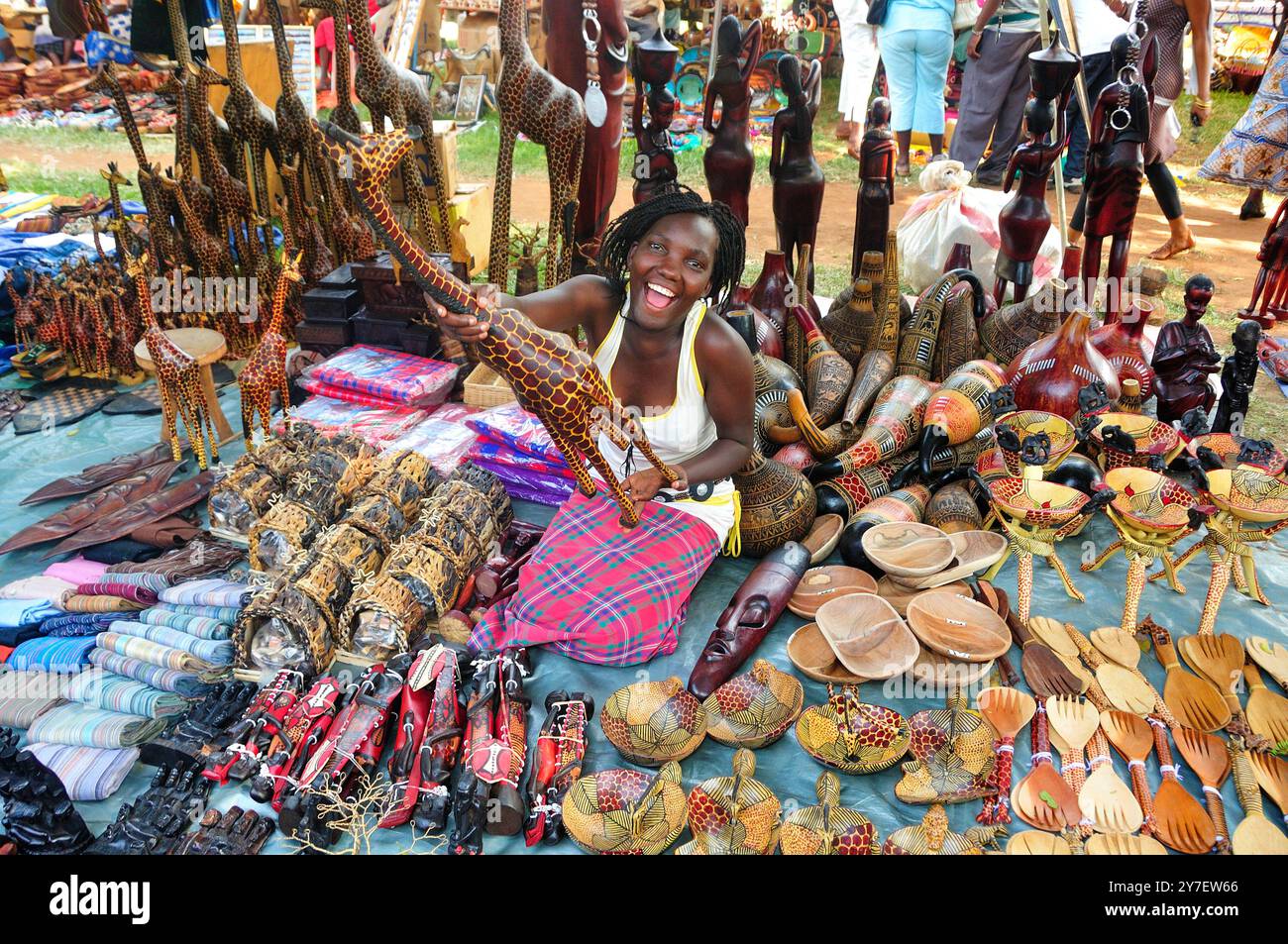 A young woman selling art curvings in Kampala Uganda Stock Photo - Alamy