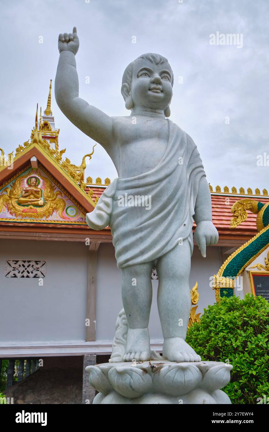 A weird, strange, freaky statue, sculpture of a child, boy, baby in a ...