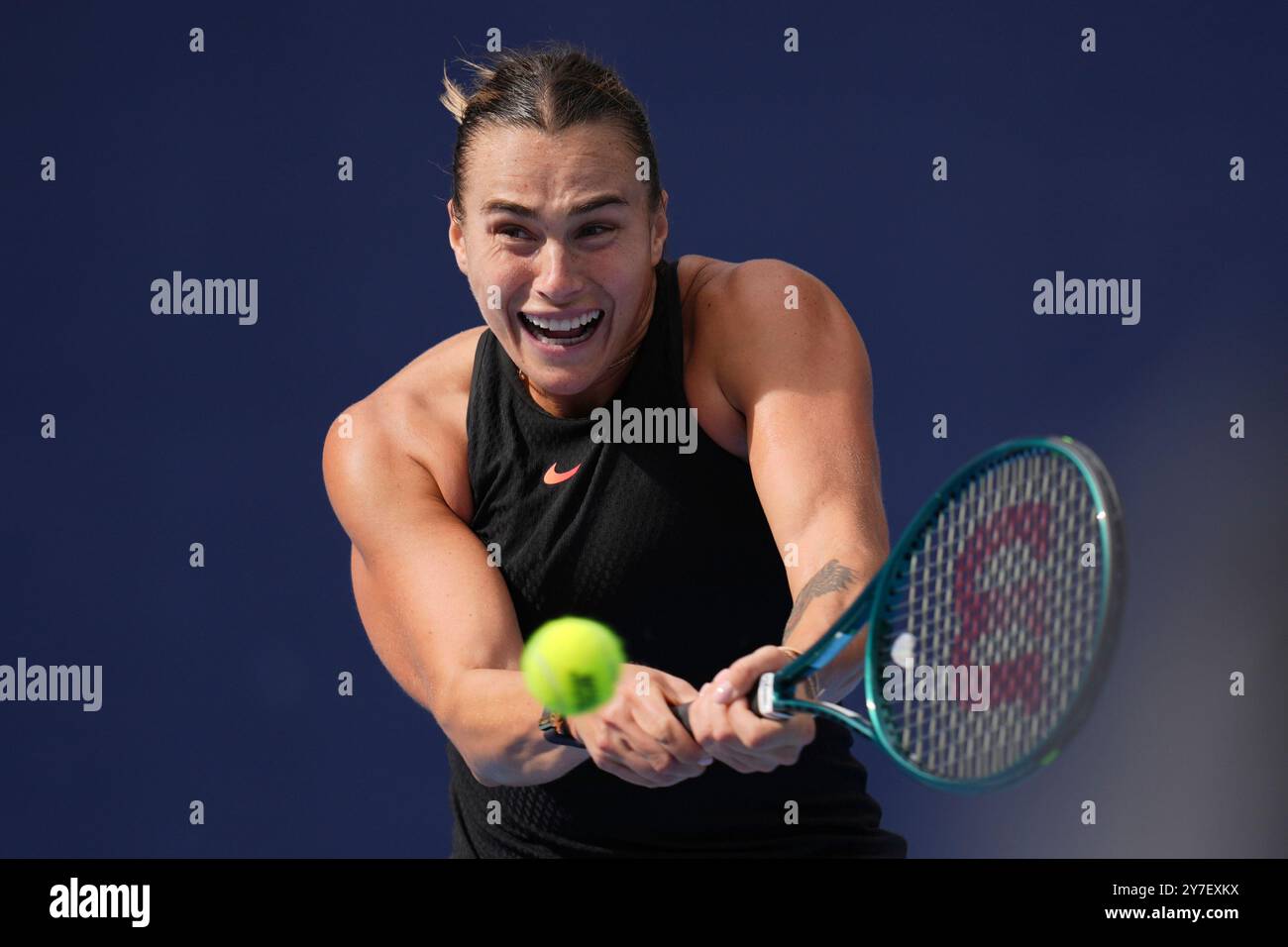 Aryna Sabalenka of Belarus returns a shot from Ashlyn Krueger of the ...
