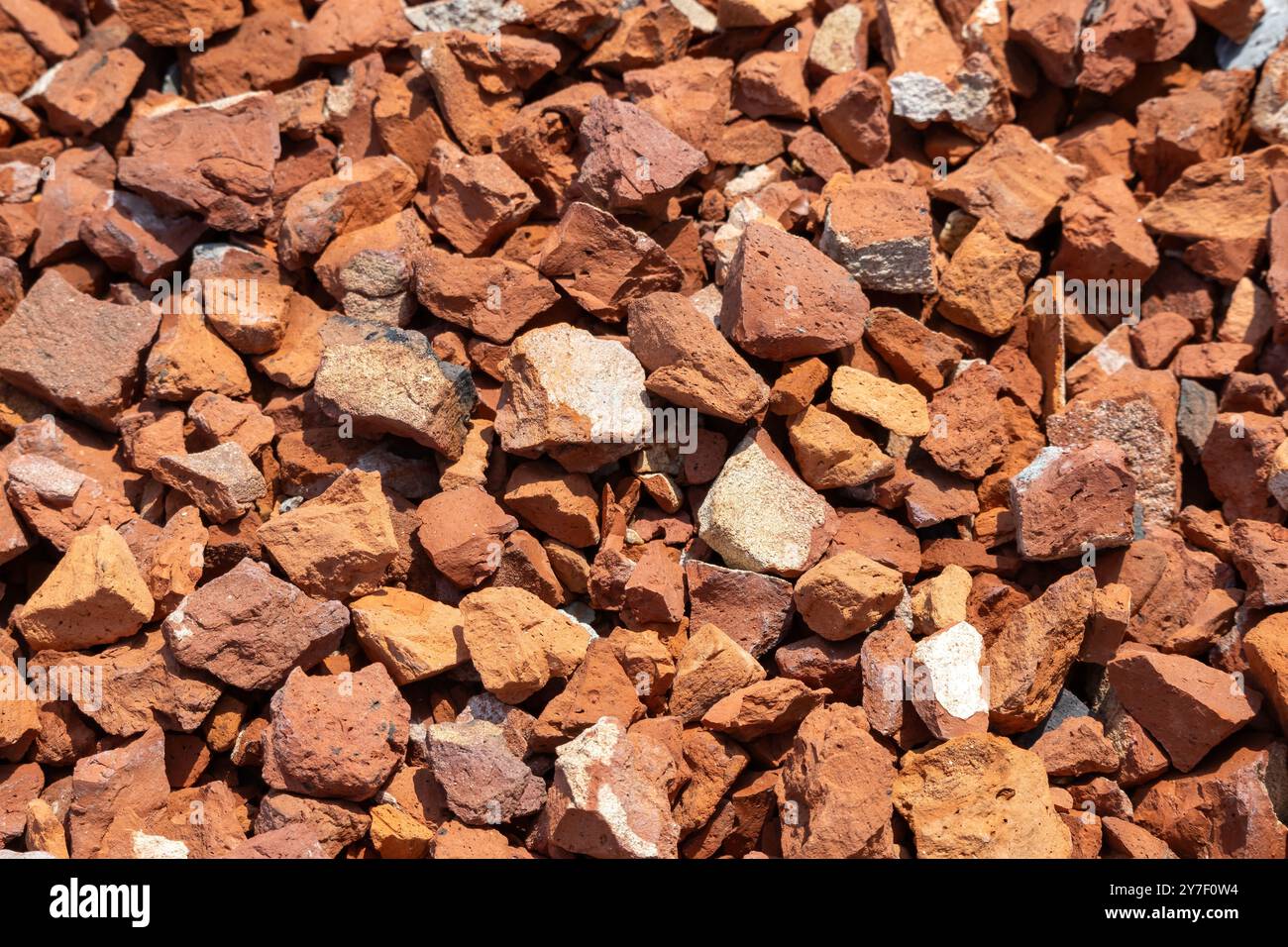 Small pieces of red clay brick or broken bricks background. These chips ...