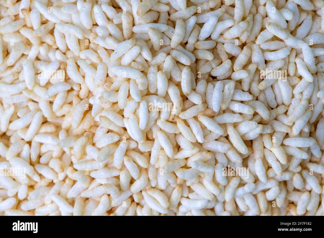 Close-up background of puffed rice or muri (also known as murmura ...