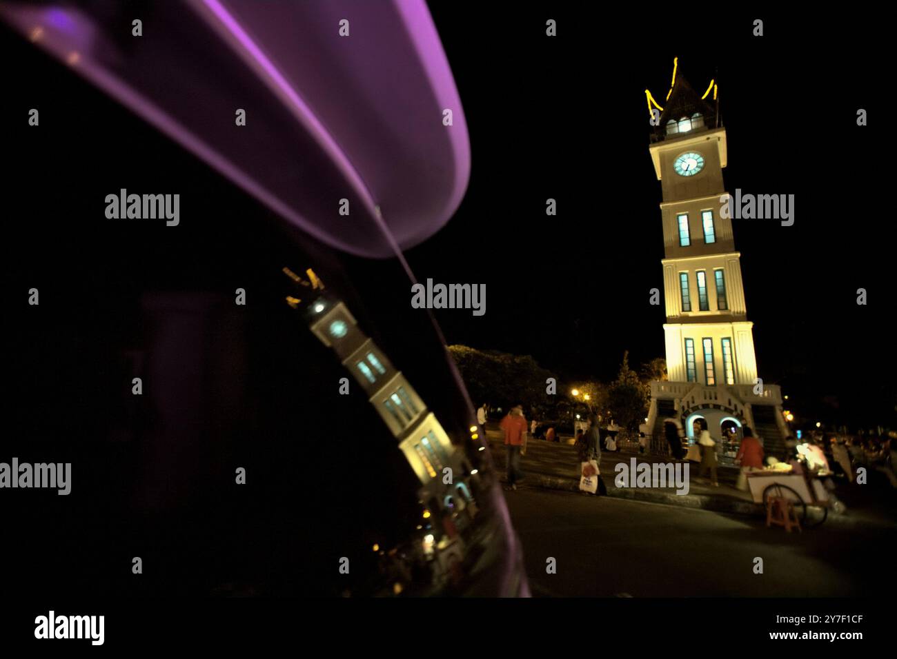 Big clock tower known locally as Jam Gadang and its reflection on car ...