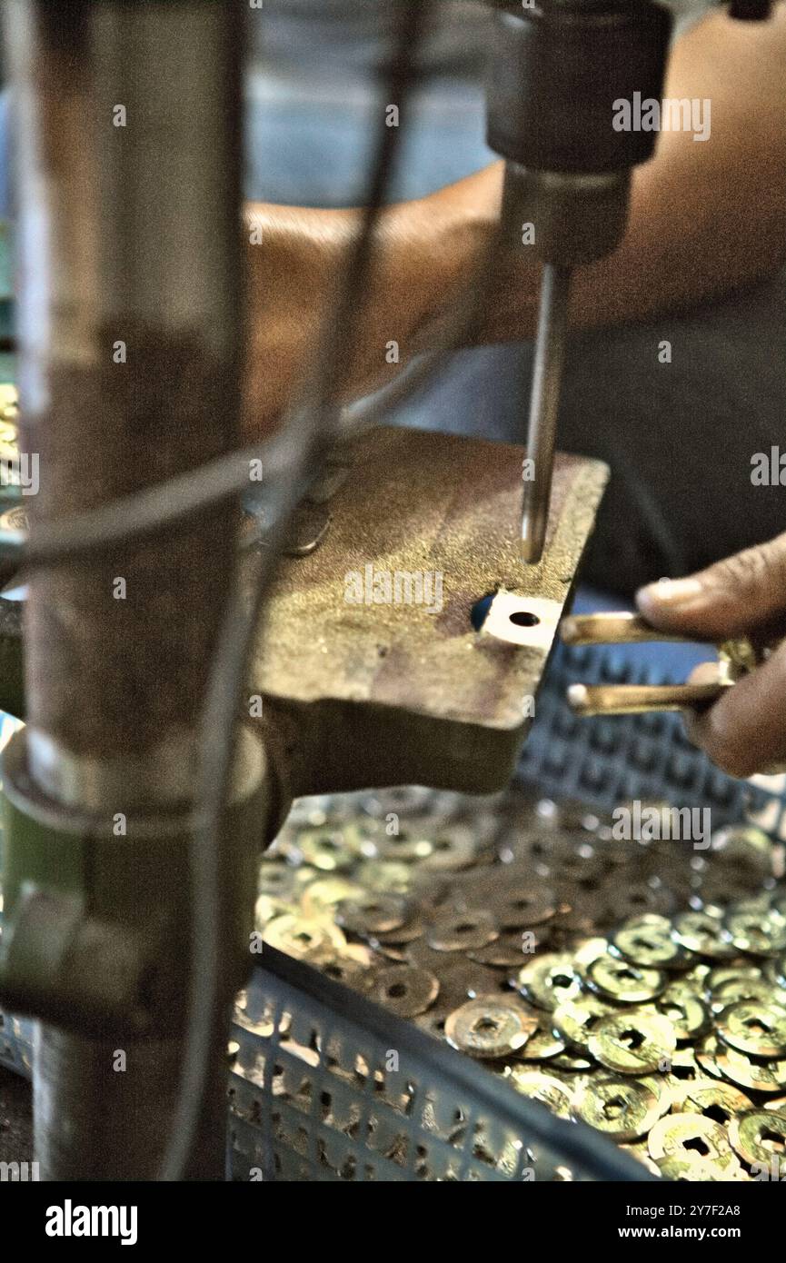 Production of traditional Balinese coins with hollow known as "pis ...