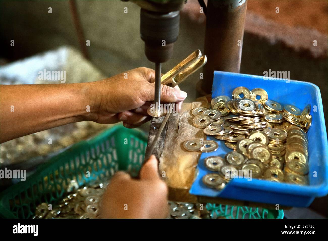 Production of traditional Balinese coins with hollow known as "pis ...