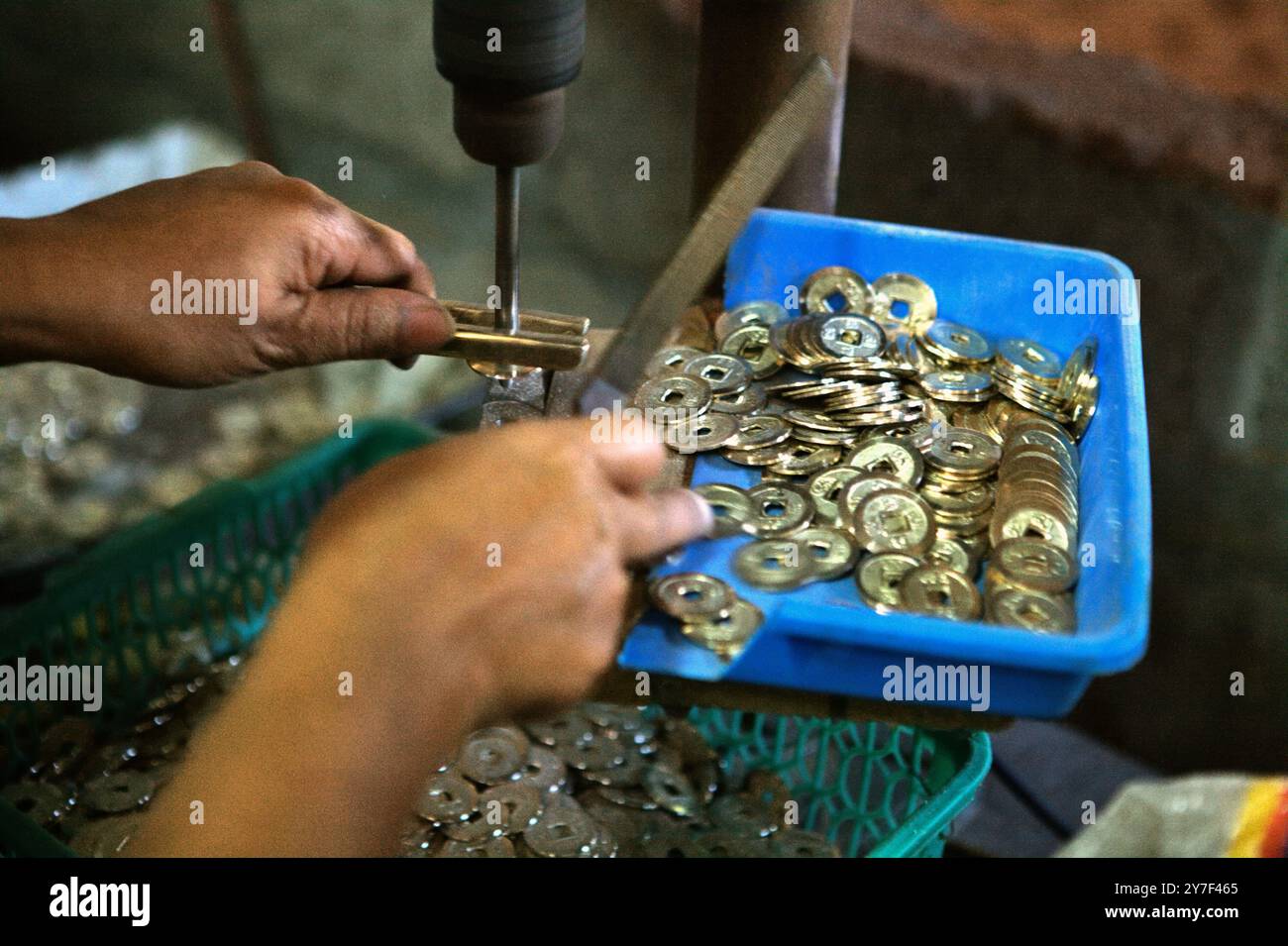 Production of traditional Balinese coins with hollow known as "pis ...