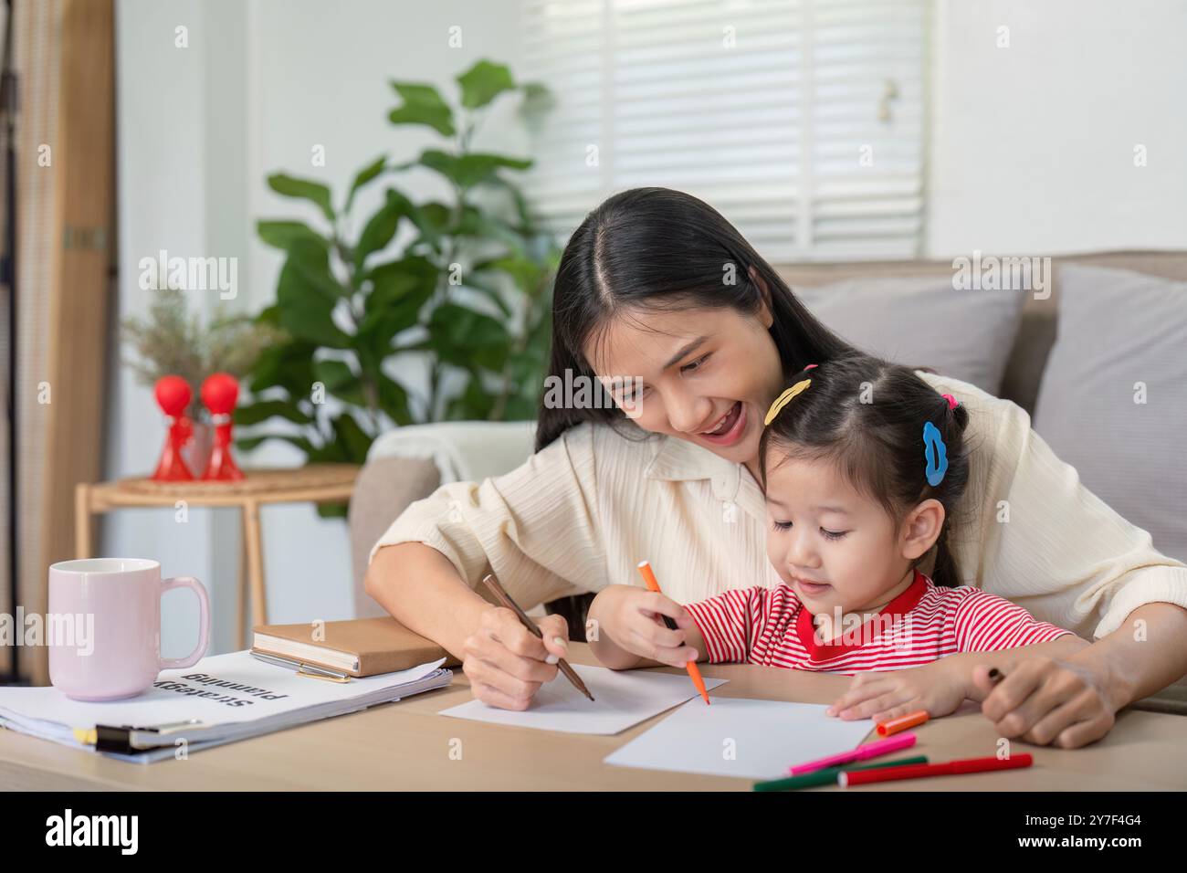 Creative Mother and Daughter Enjoying Collaborative Drawing Session ...