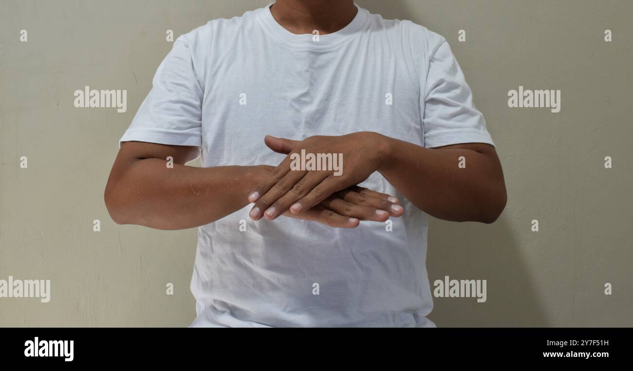 Young man showing slow please sign in asl, communication for deaf Stock ...