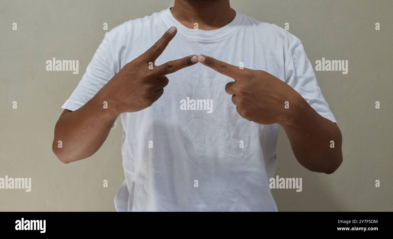 Young man learning and communicating in american sign language Stock ...