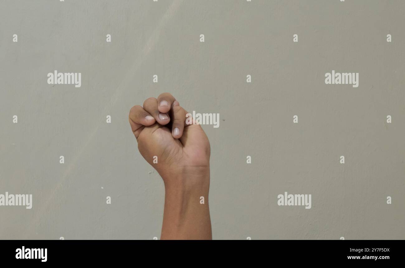 Finger spelling letter M in american sign language Stock Photo - Alamy