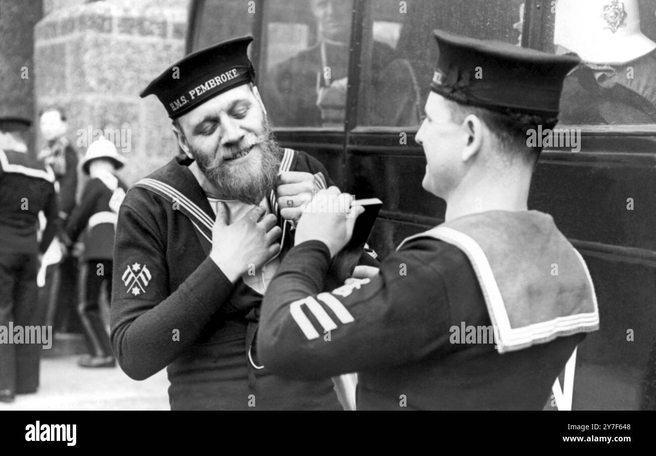 London: Leading signalman R. Waggitt gives a fimal grooming to his ...