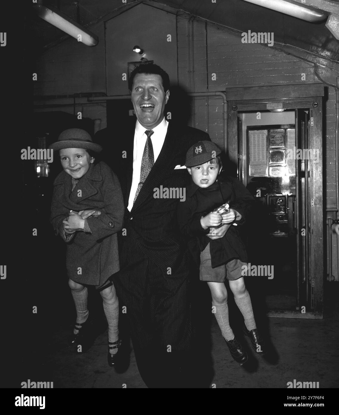 Comedian-magician Tommy Cooper is seen off from London Airport, before ...