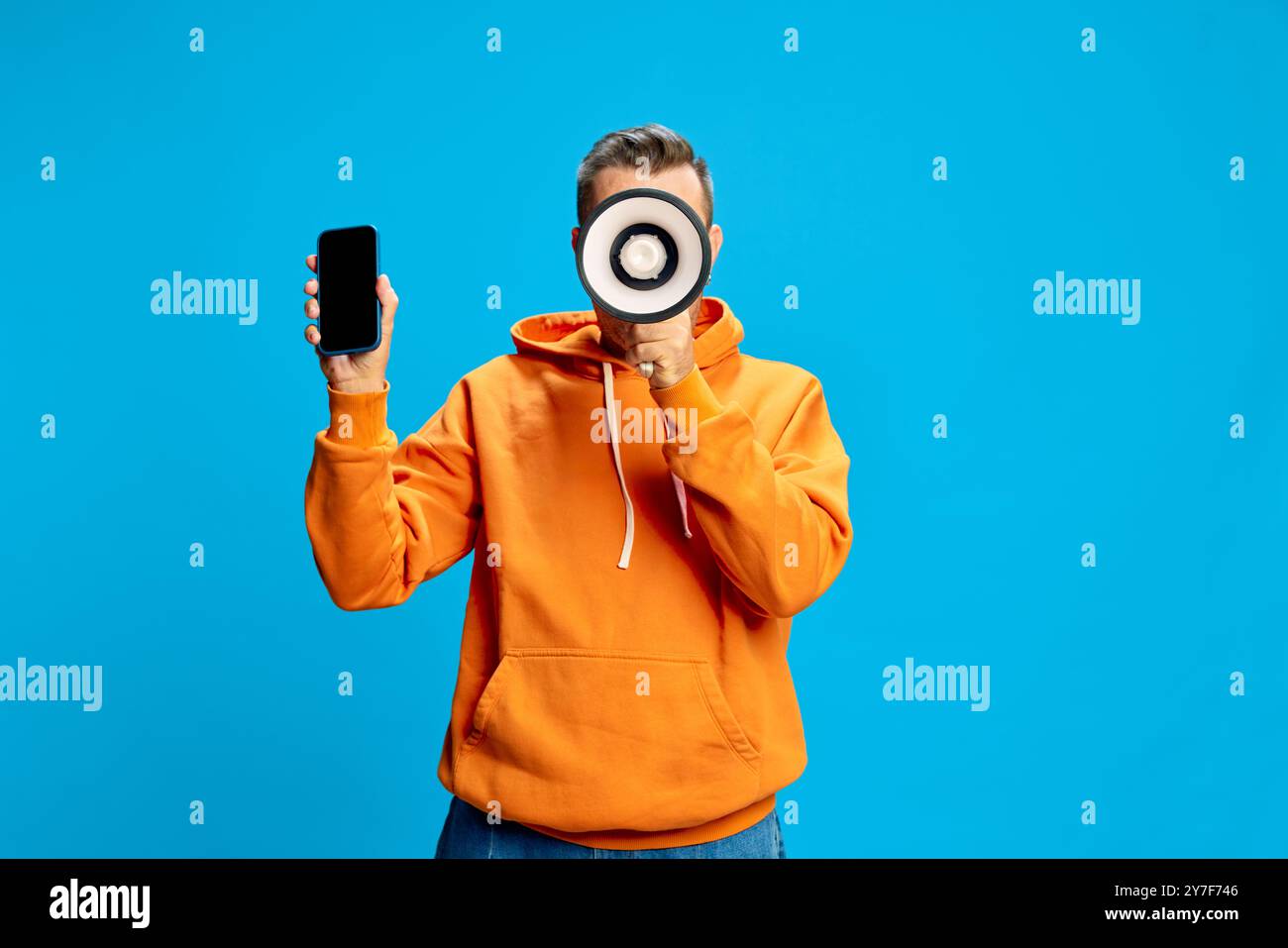 Man makes powerful statement with megaphone and smartphone in hand ...
