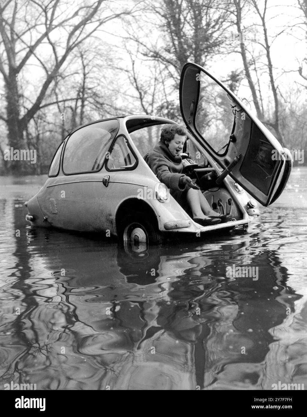 A bubble-car stuck in floodwater, 1959 Stock Photo - Alamy