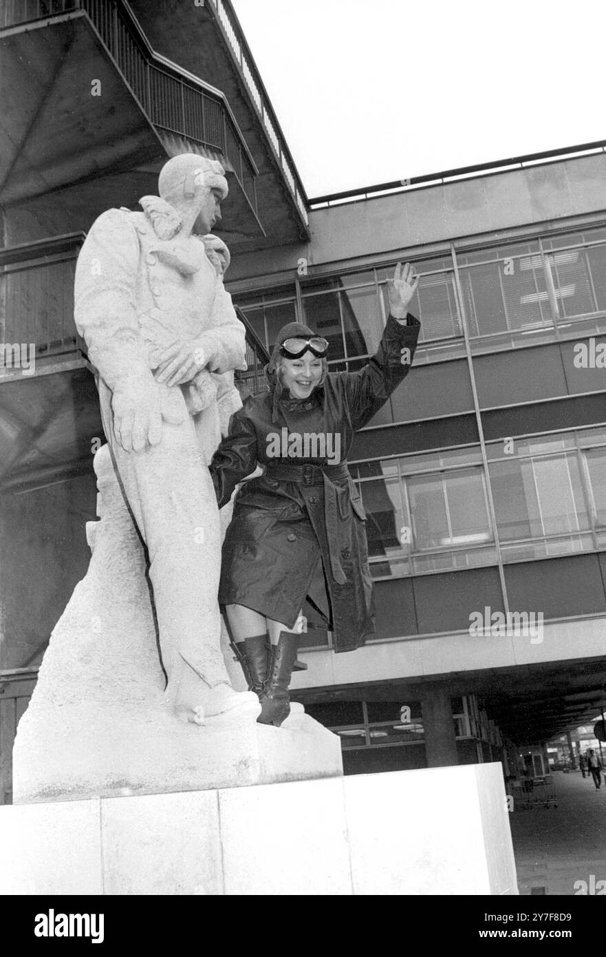 Comedienne Joan Turner poses in Amy Johnston flying outfit as she lies ...