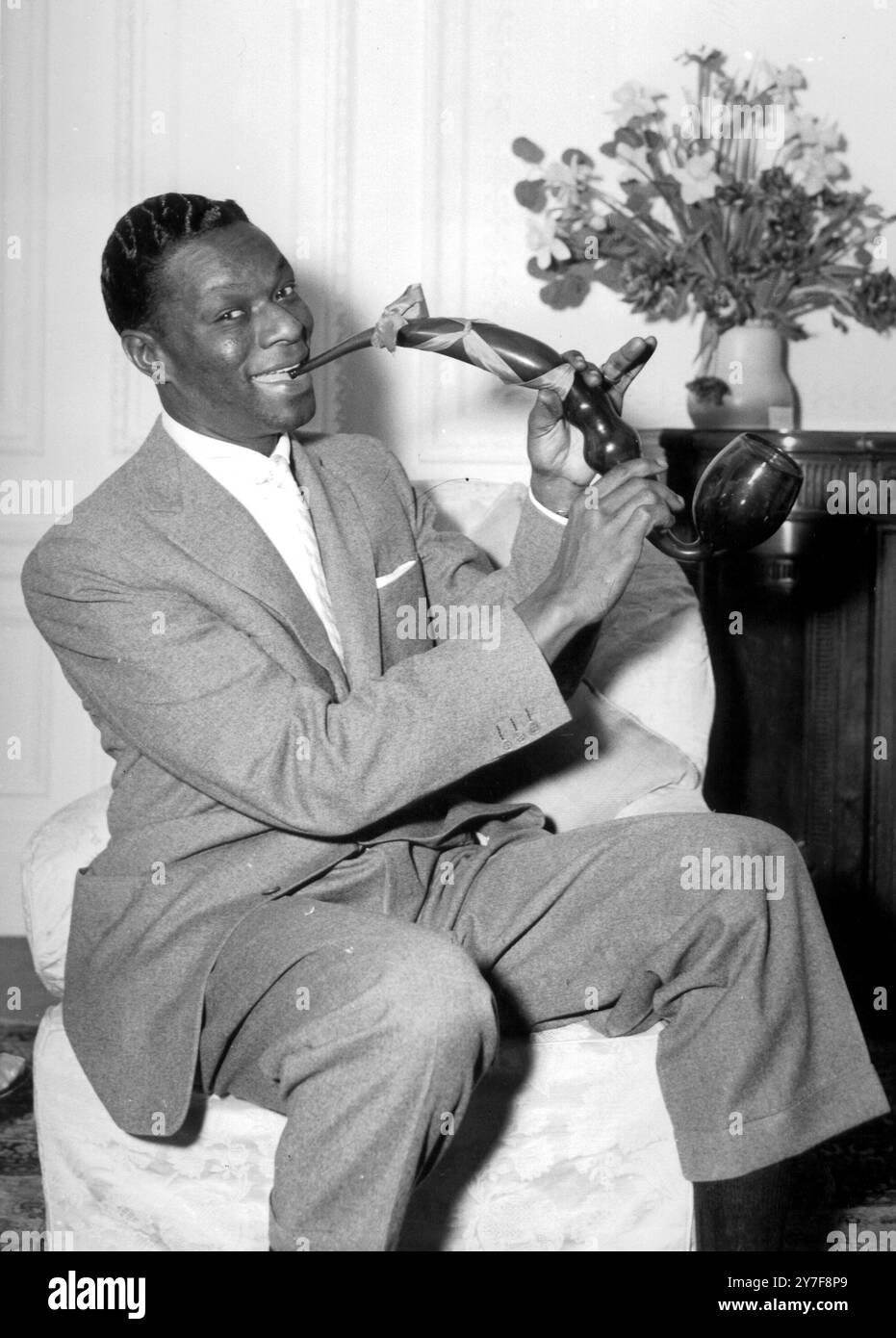 Nat King Cole, famous American singer shown smoking a Bristol Glass ...