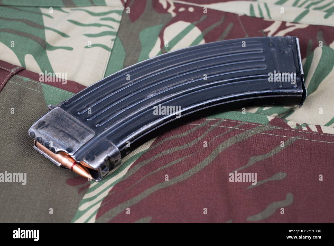 kalashnikov ammunition magazine with cartridges on camo uniform ...