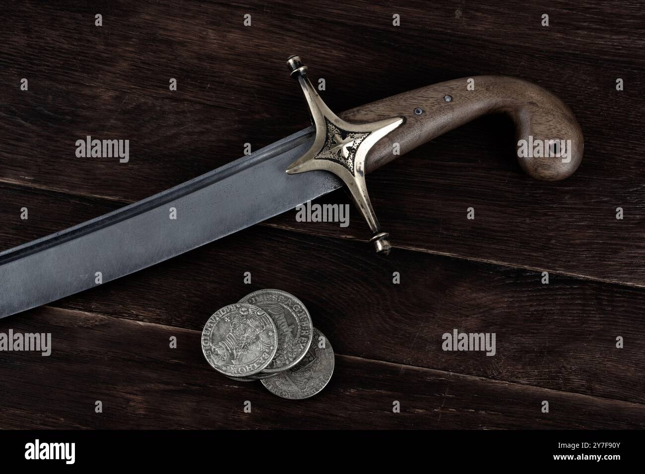 Ukraine Saber Sword with silver taller coins on wooden deck, 17th ...